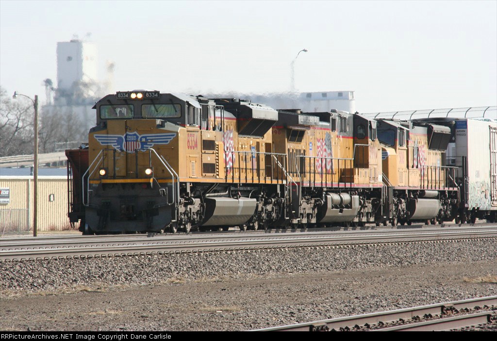 UP 8334 leads a WB manifest past F ave @ 10:43